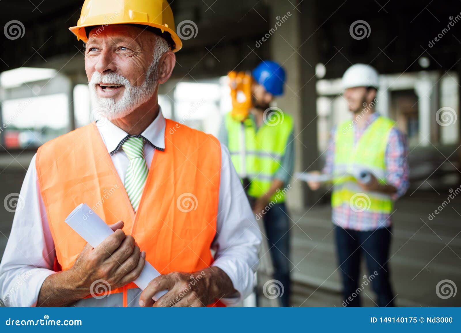 Engineer, Foreman and Worker Discussing in Building Construction Site ...