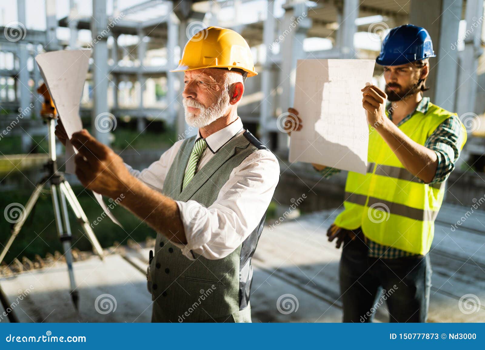 Engineer, Foreman and Worker Discussing in Building Construction Site ...