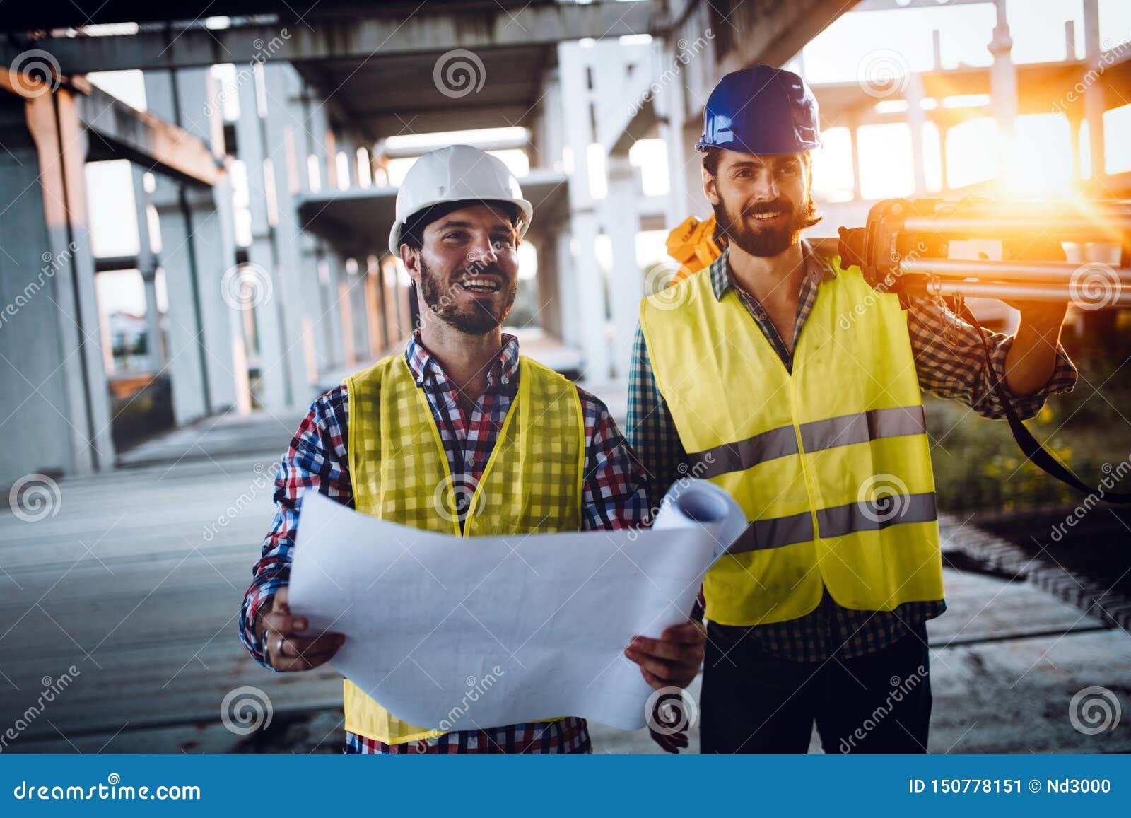 Engineer, Foreman and Worker Discussing in Building Construction Site ...