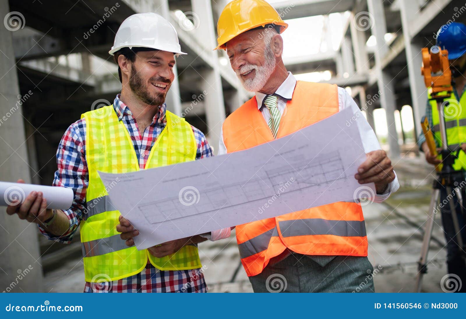 Engineer, Foreman and Worker Discussing in Building Construction Site ...