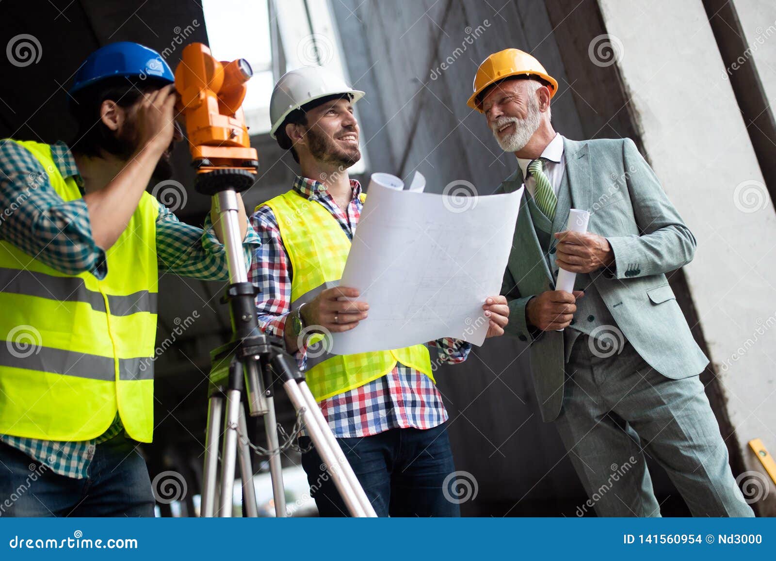 Engineer, Foreman and Worker Discussing in Building Construction Site ...