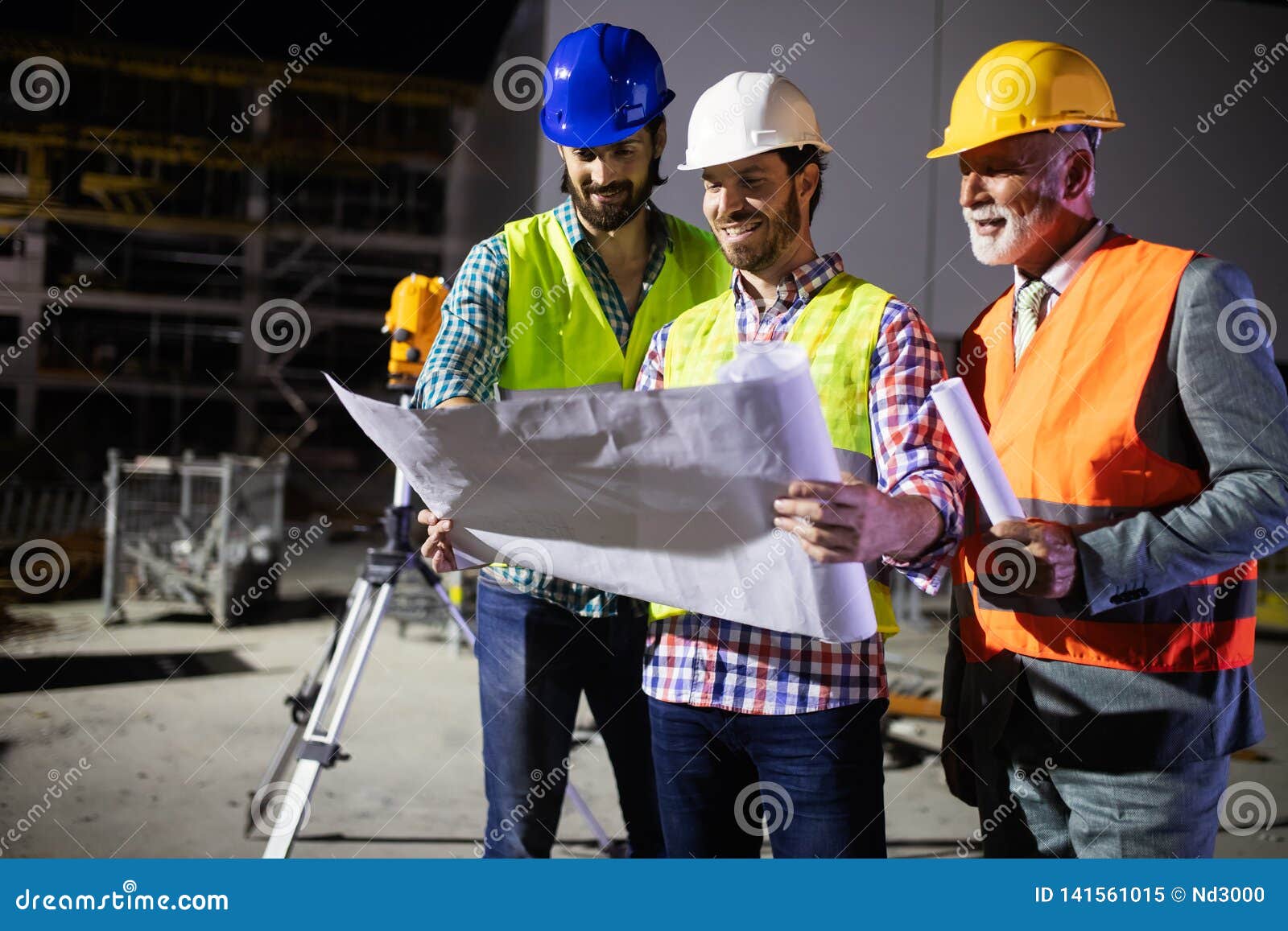 Engineer, Foreman and Worker Discussing in Building Construction Site ...