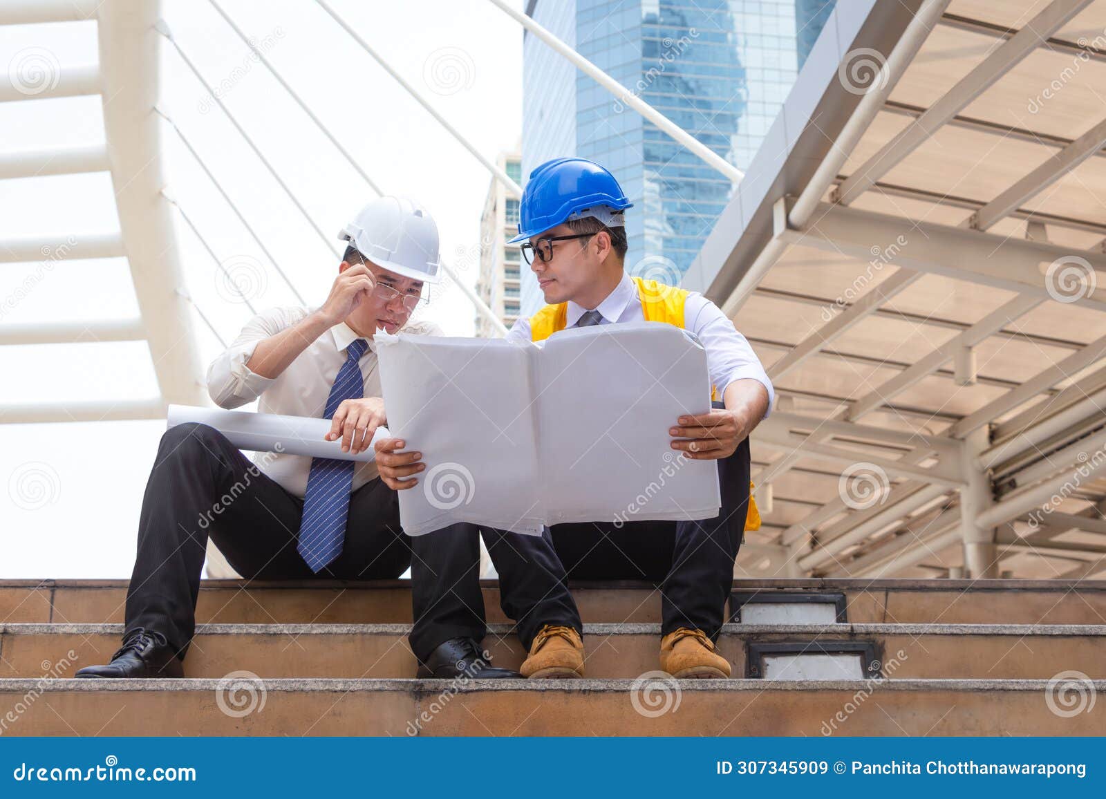 Engineer and Foreman Worker Team with Blueprint Paper Planning Projects ...