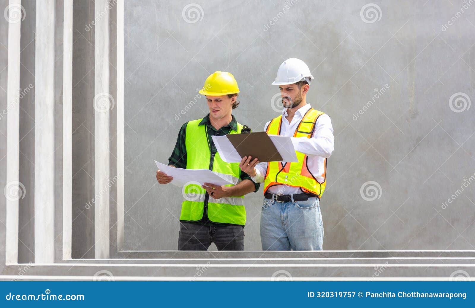 Engineer and Foreman Worker Team with Blueprints Checking Project at ...