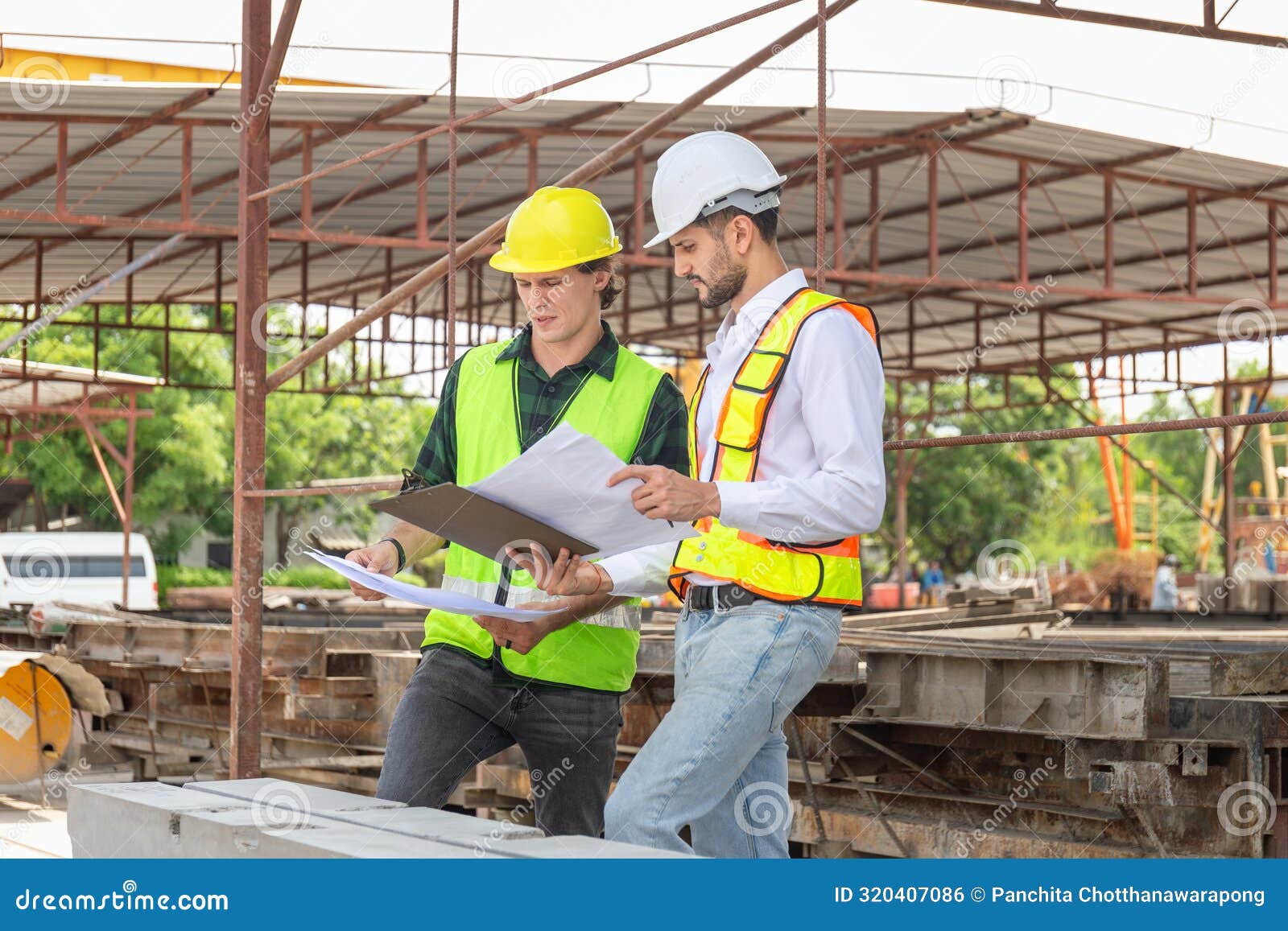 Engineer and Foreman Worker Team with Blueprints Checking Project at ...