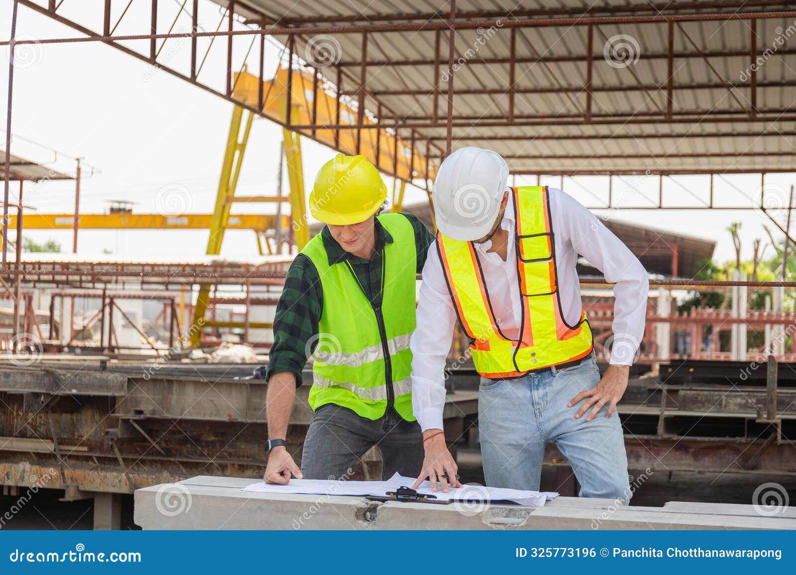 Engineer and Foreman Worker Team with Blueprints Checking Project at ...