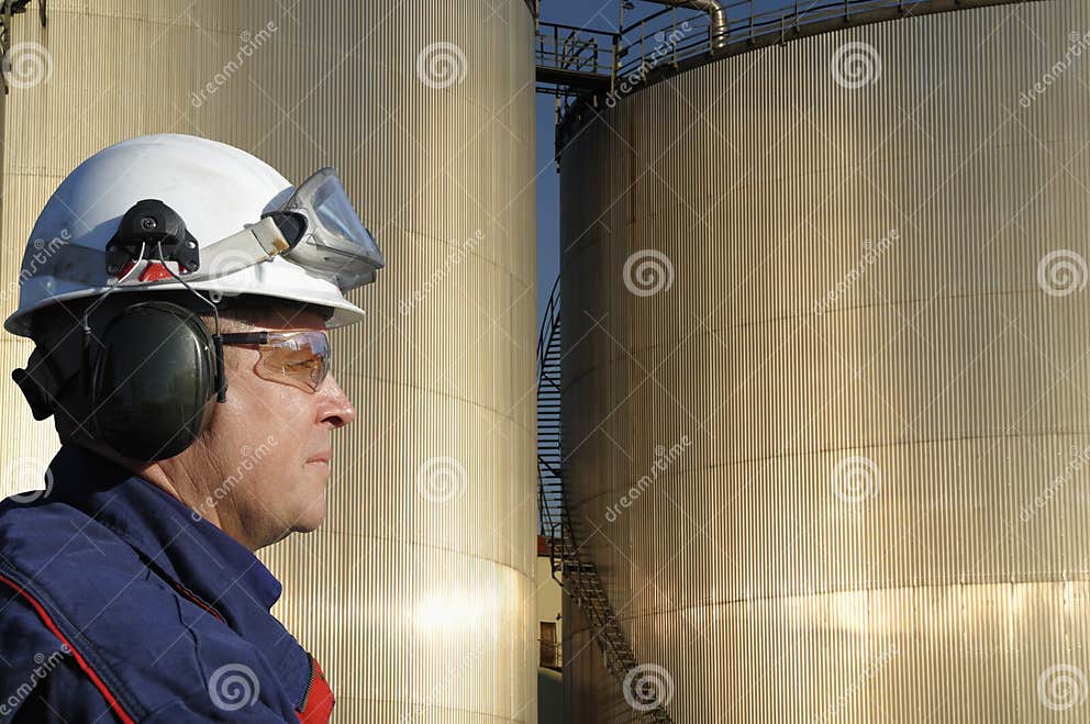 Engineer with fuel towers stock image. Image of industry - 22666221