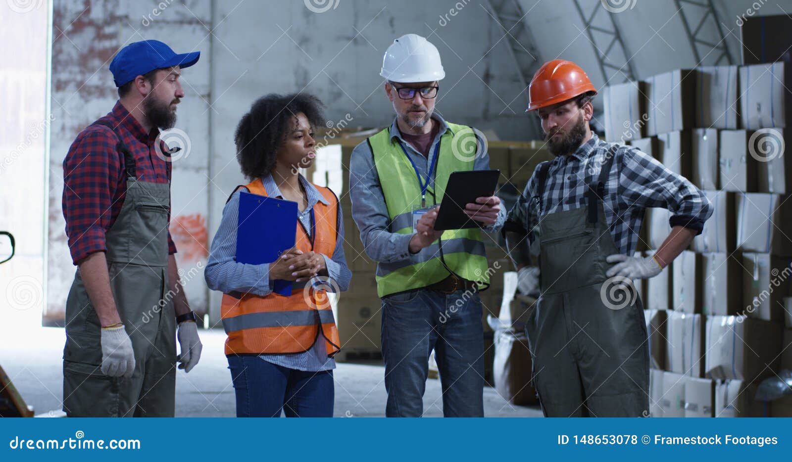Engineer Giving Out Instructions in a Warehouse Stock Photo - Image of ...