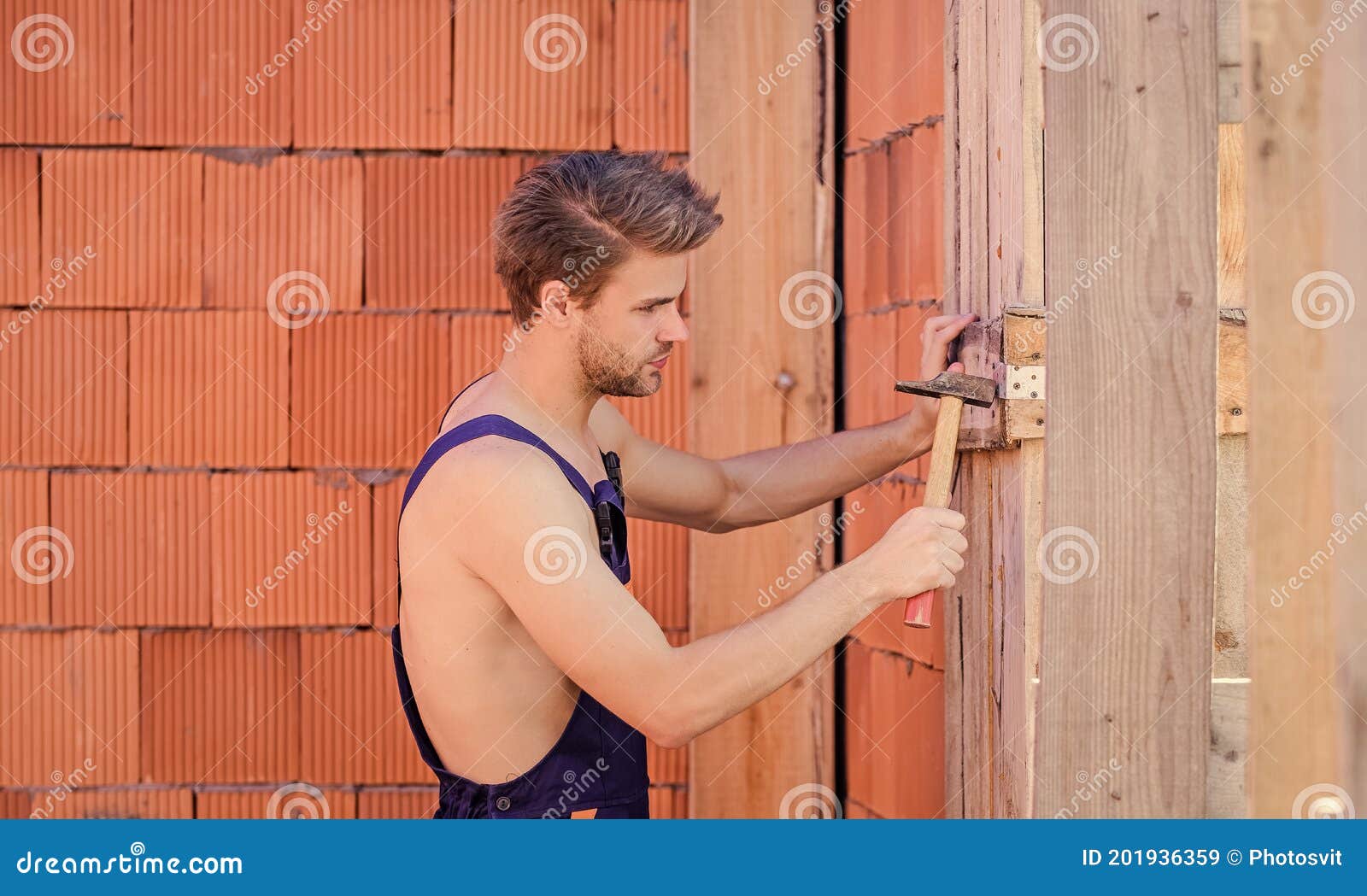 Engineer with Hammer Tool. Muscular Worker with Hammer Brick Wall ...