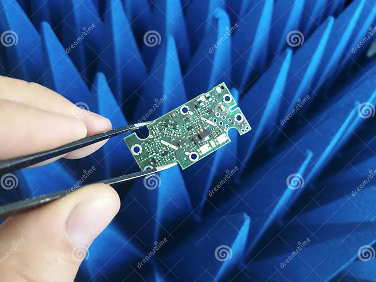 Engineer Hand Holding PCB in Front of EMC Absorbers Stock Image - Image ...