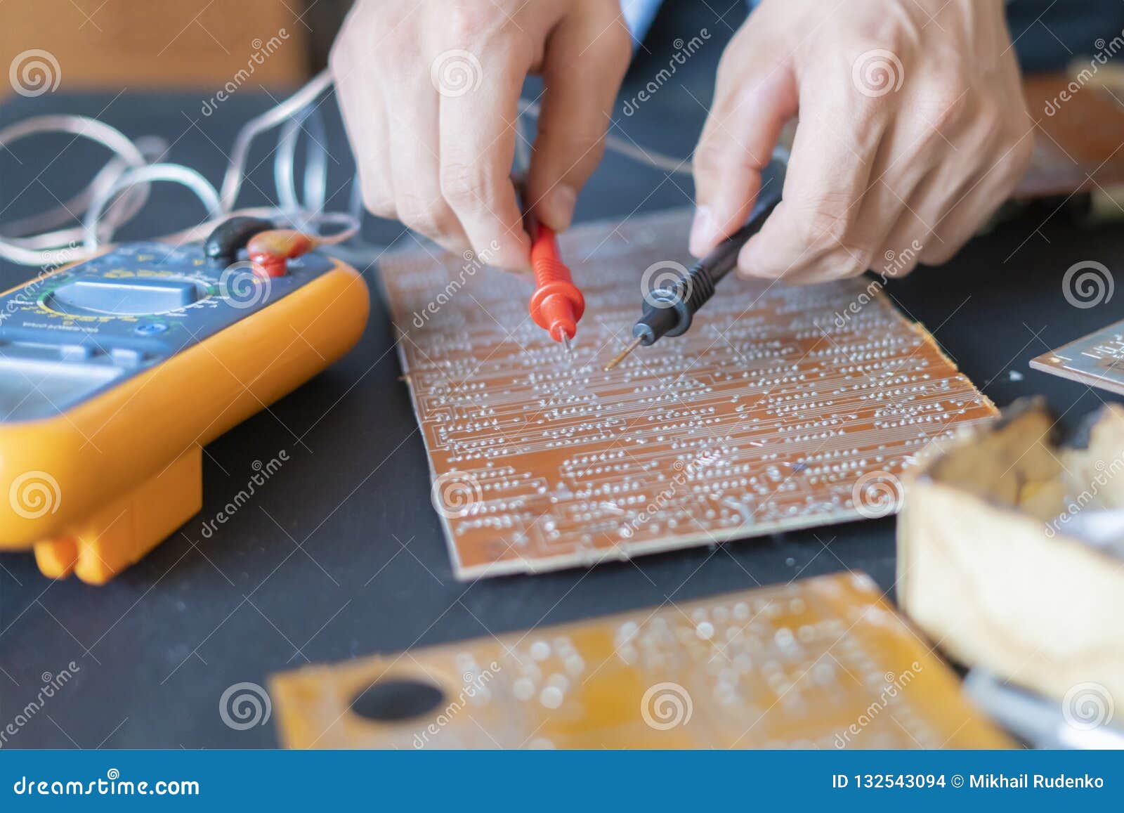 Engineer Hands Measure the Voltage Current on the Electronic Board F ...