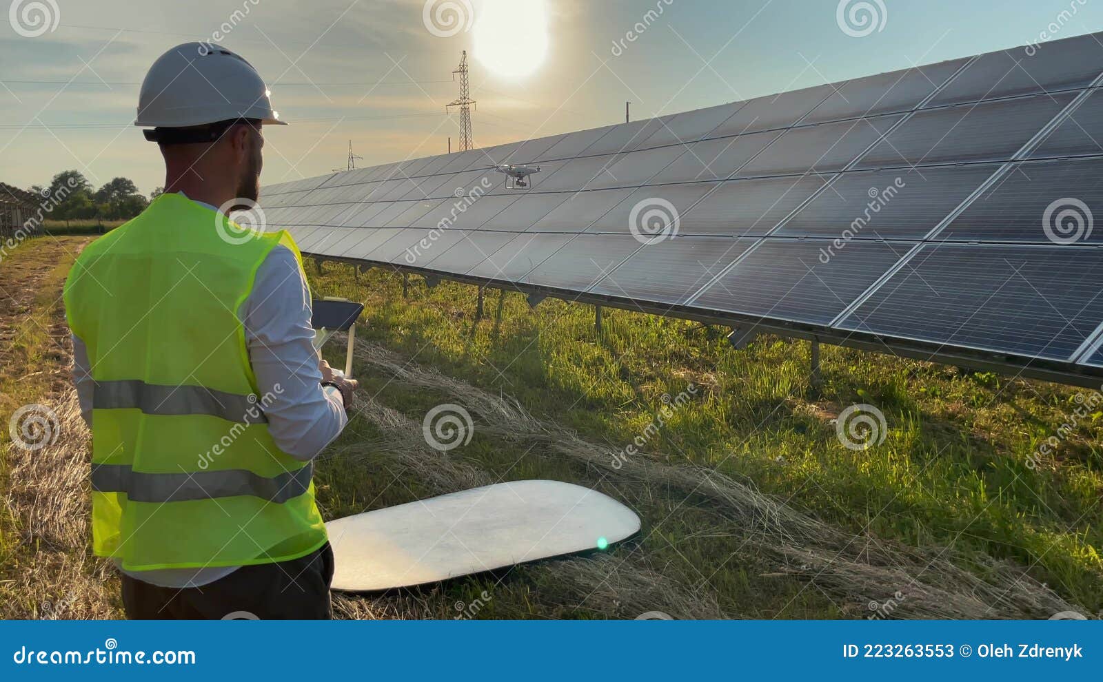 Engineer in Hardhat Holding Tablet Computer Operating Flying Drone in ...
