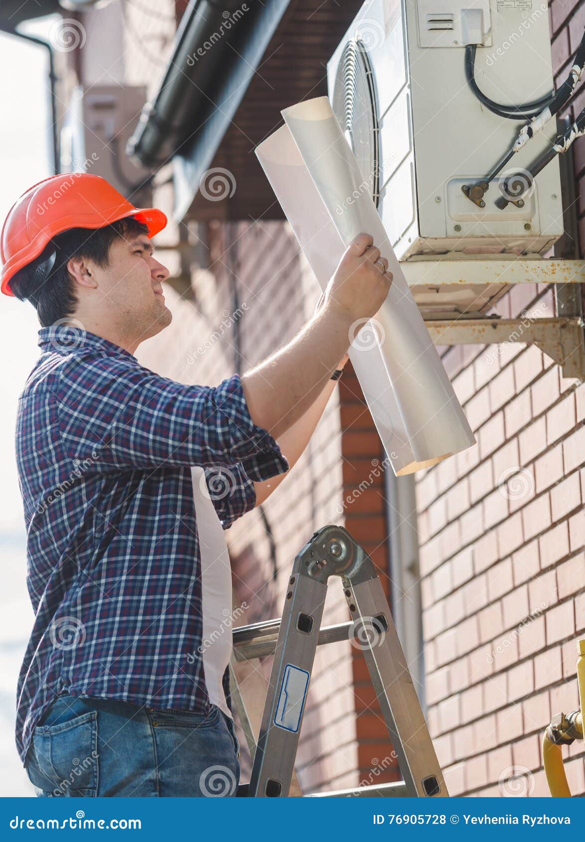 Engineer in Hardhat Looking in Plan of Air Conditioning System Stock ...