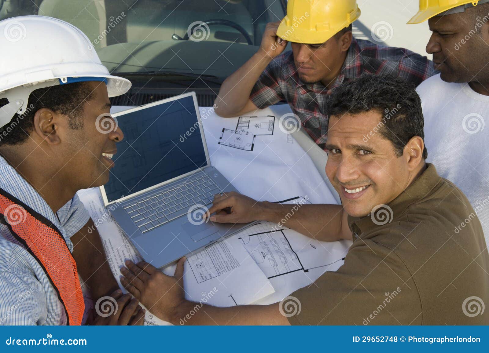 Engineer Having Discussion with Team of Architects Stock Photo - Image ...