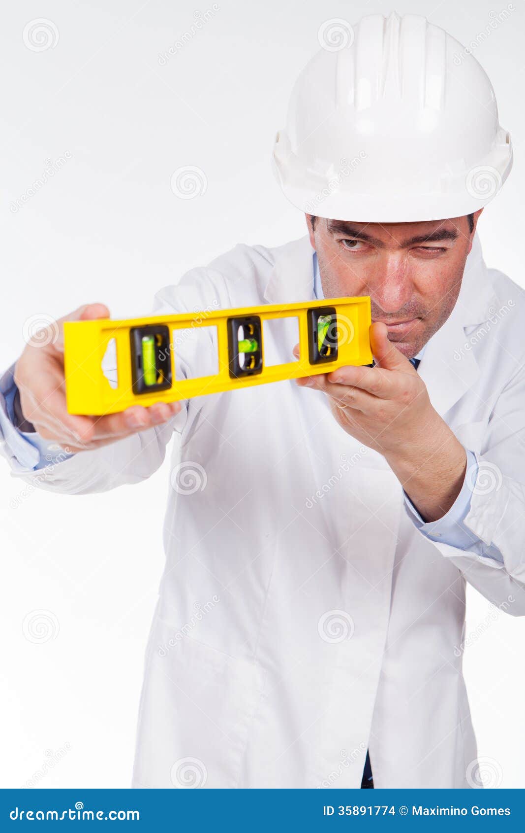 Engineer with a Helmet Paying Attention and Using a Lev Stock Photo ...