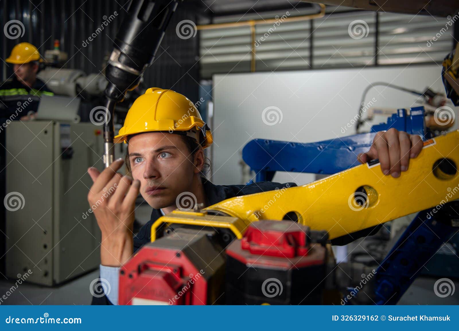 Engineer Inspection Control a Robot Arm Welding Machine with a Remote ...