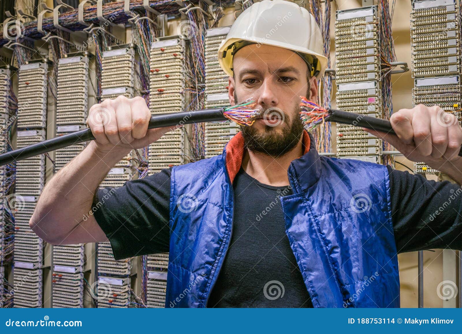 Worker Restores The Connection In The Data Center Server Room. Engineer ...