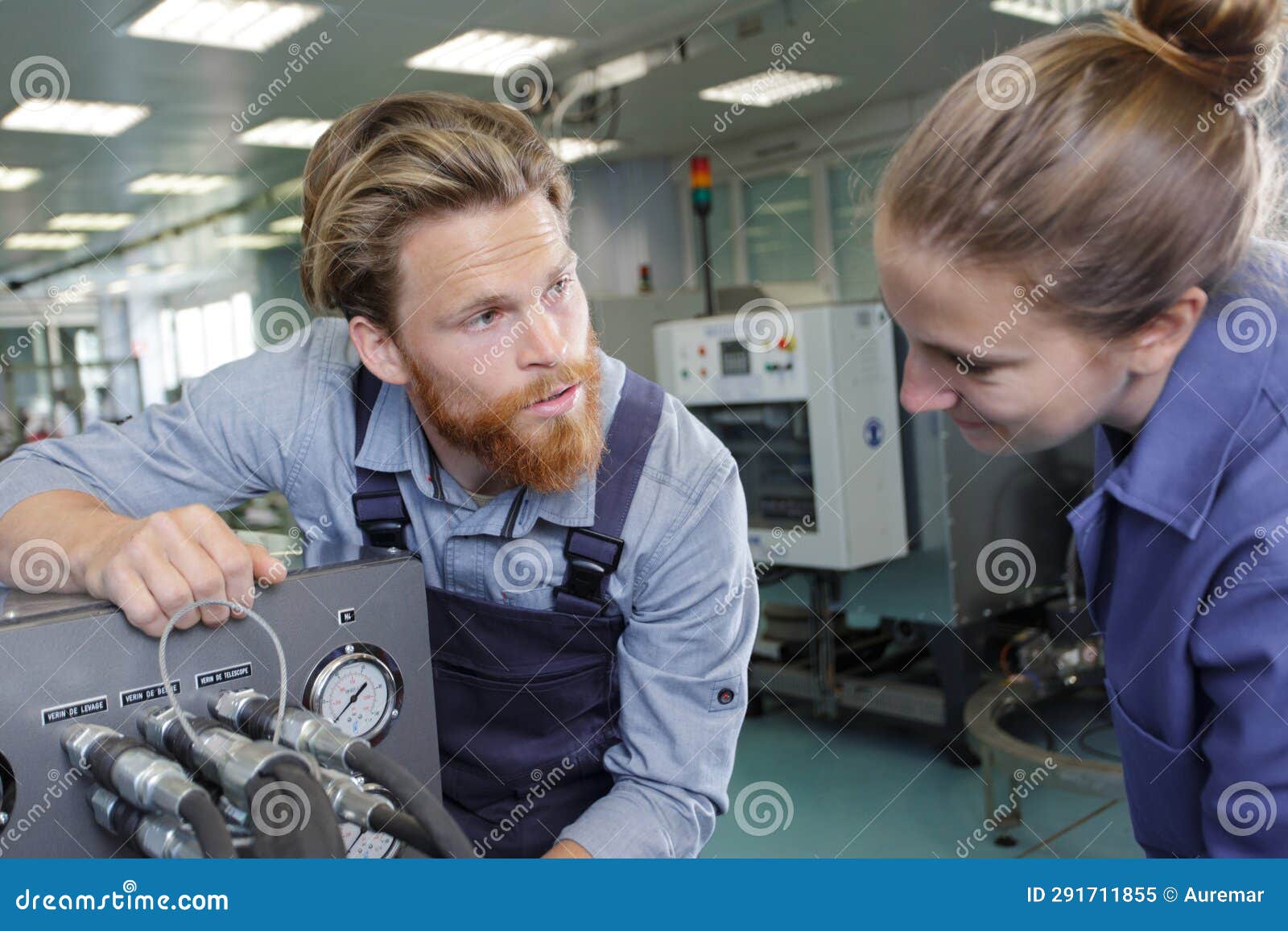 Engineer Helping Female Apprentice in Factory Stock Image - Image of ...