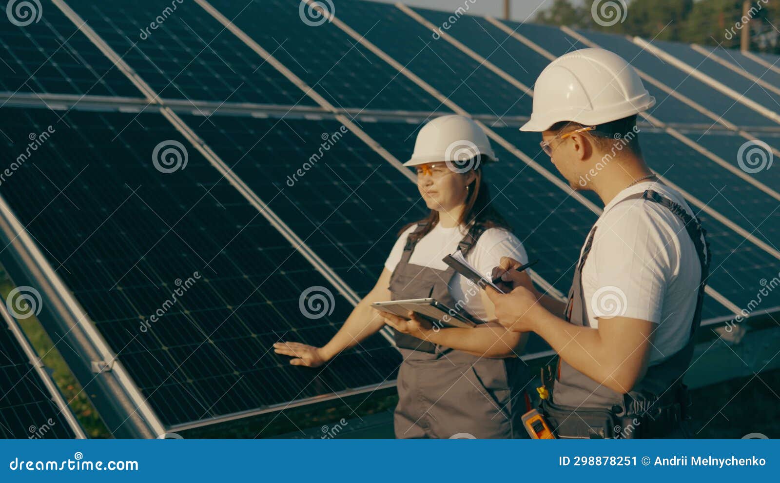 An Engineer and His Assistant Check the Operation of Solar Panels Stock ...