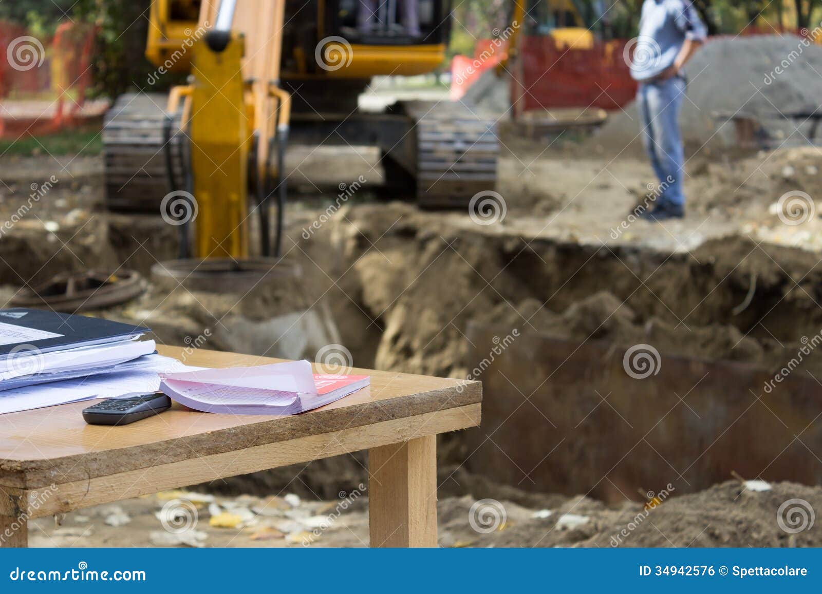 Engineer and His Working Desk with Work Orders, Site Engineer Co Stock ...