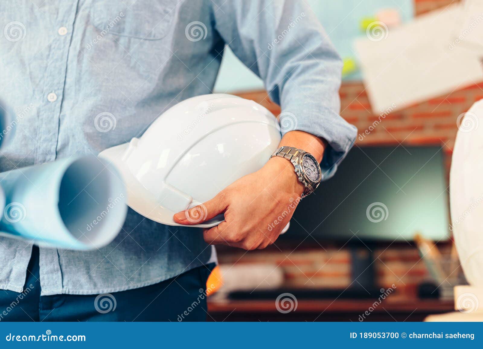 Engineer Hold Engineer Drawing Design Blueprints and Safety Helmet in ...