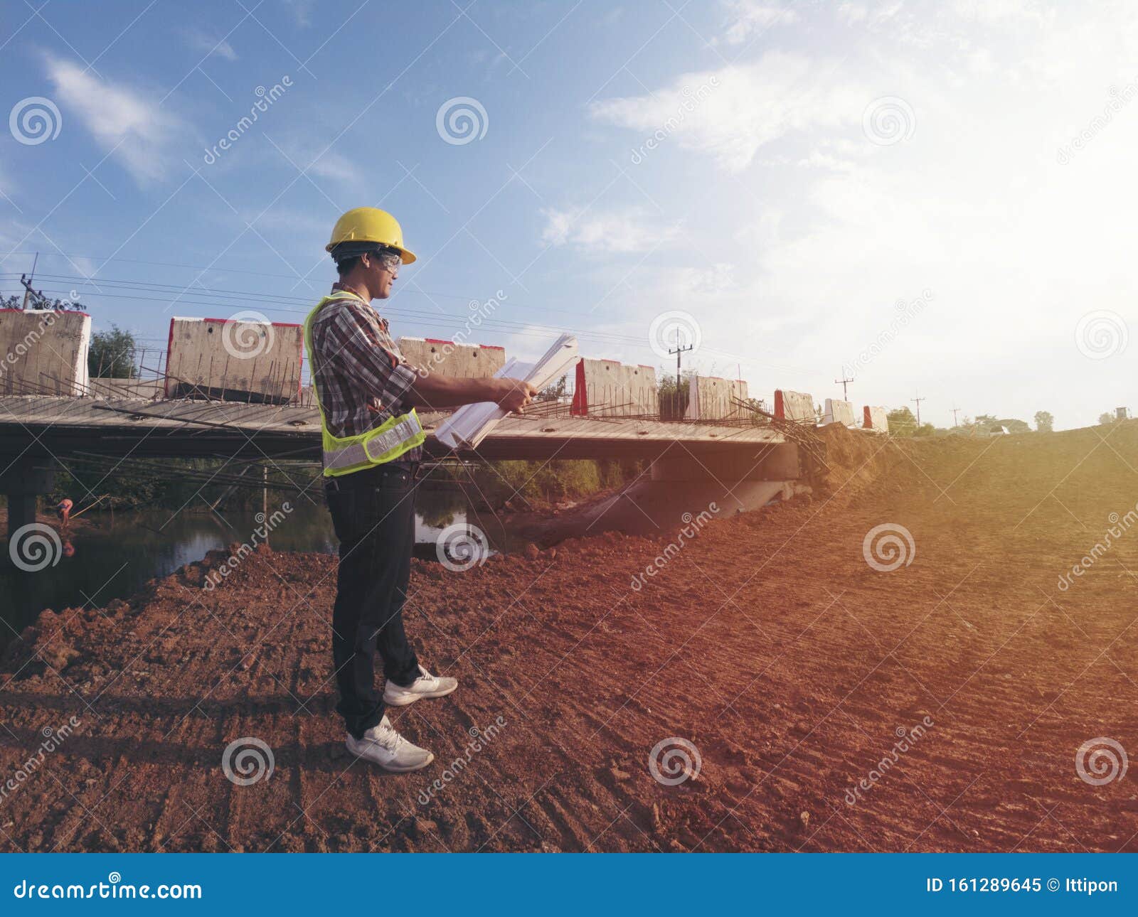 Engineer Holding Blueprint in Construction Site Stock Image - Image of ...