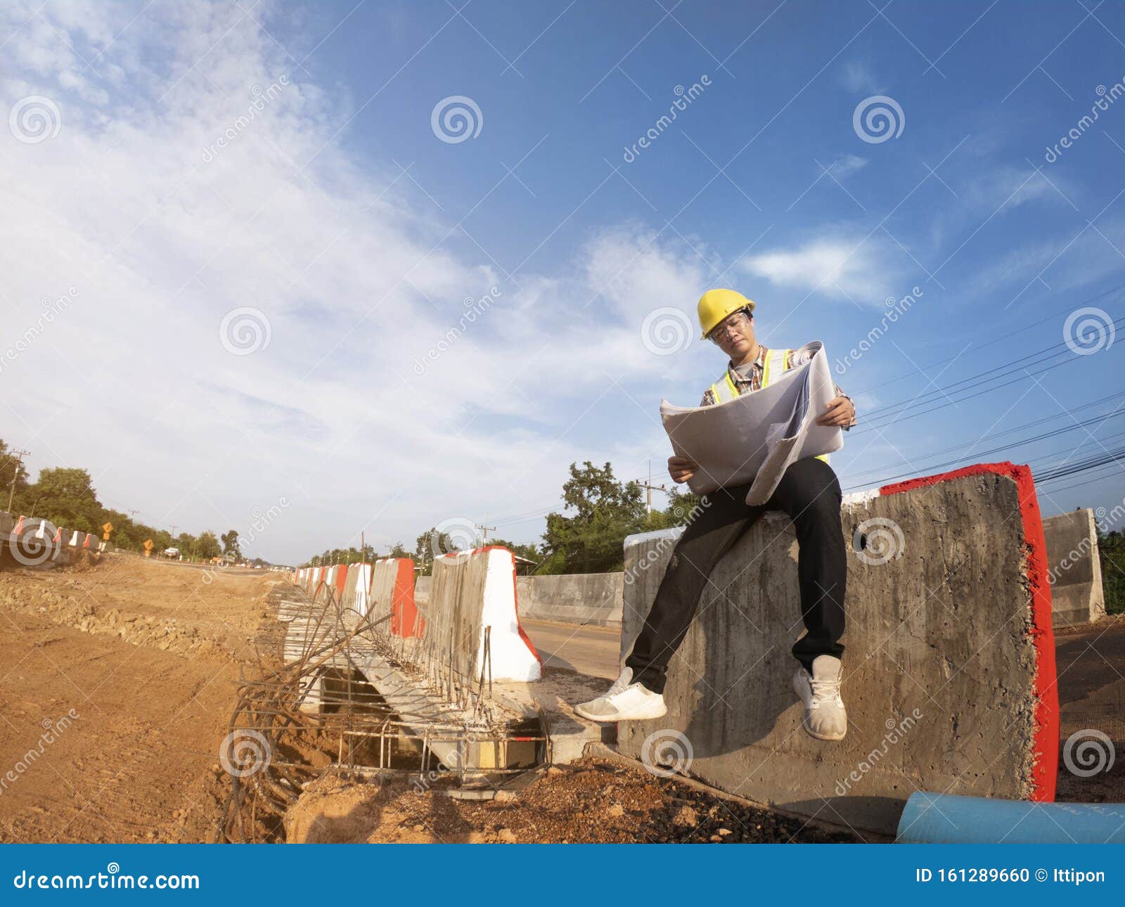 Engineer holding blueprint stock photo. Image of engineers - 161289660