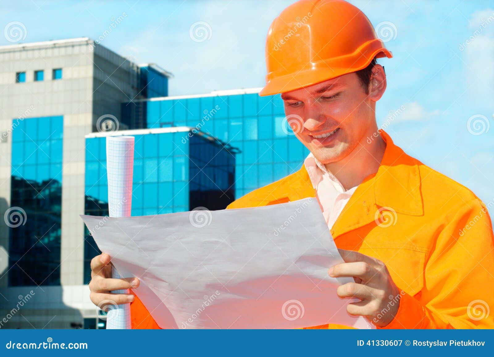 Engineer Holding Blueprints Stock Image - Image of builder, smile: 41330607