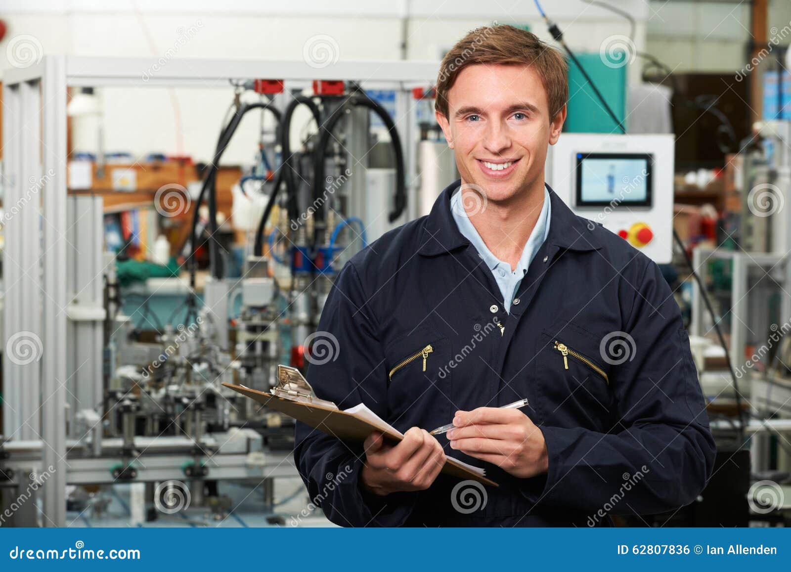 Engineer Holding Clipboard in Factory Stock Photo - Image of ...