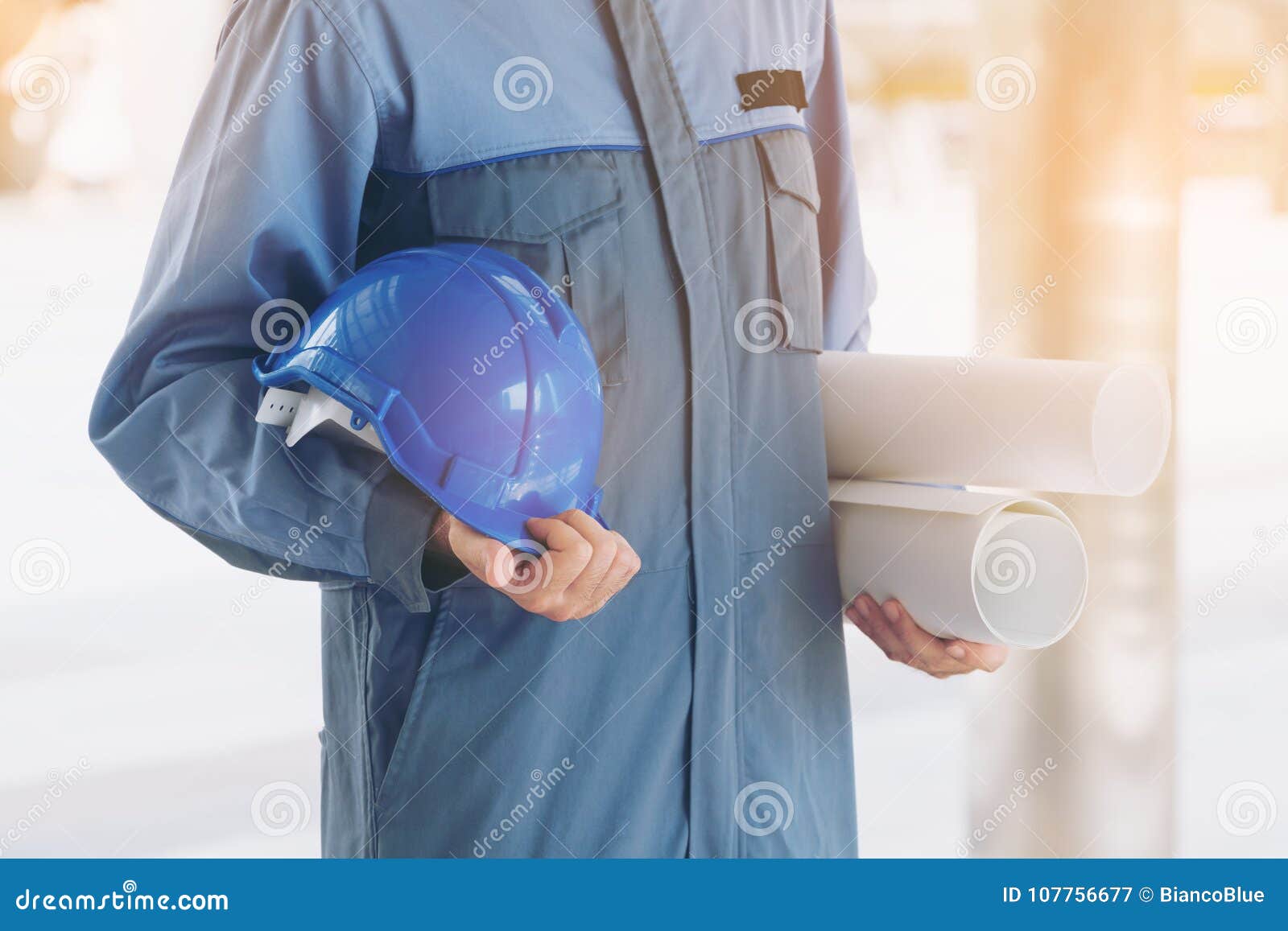 Engineer Holding Hard Hat and Blueprint Stock Image - Image of factory ...