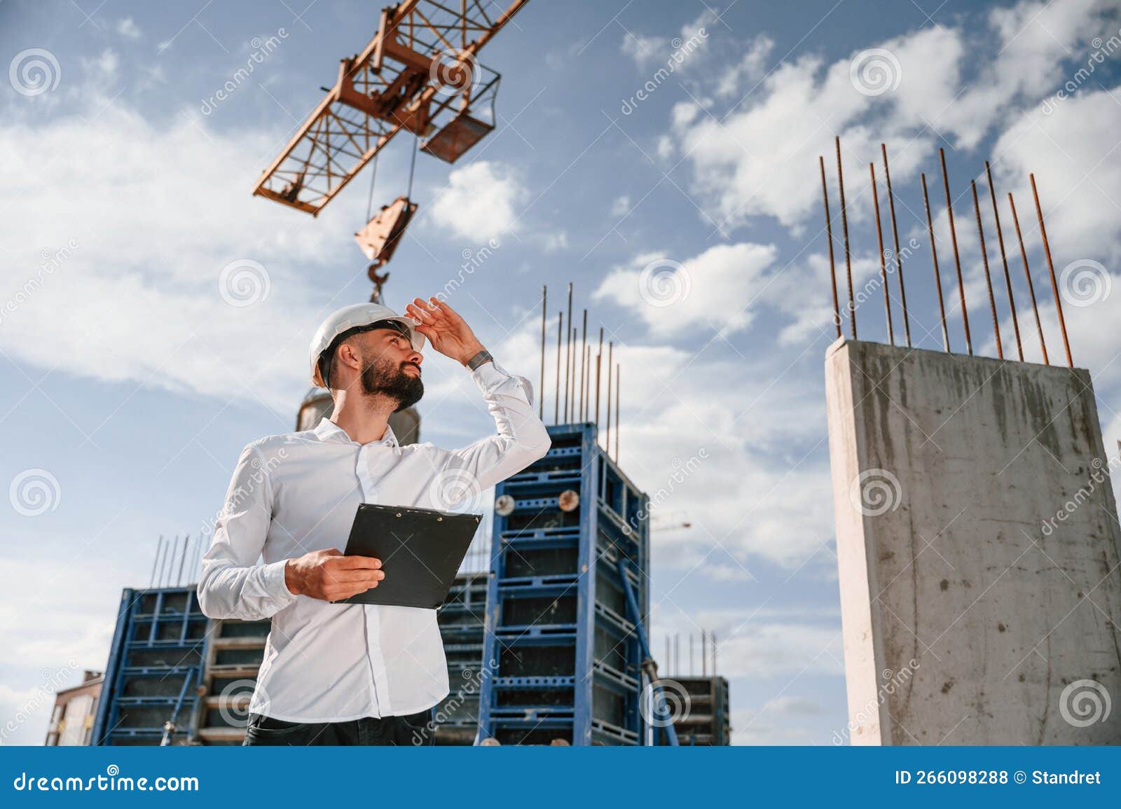 Engineer is Holding Notepad. Man in Uniform is Working on the ...
