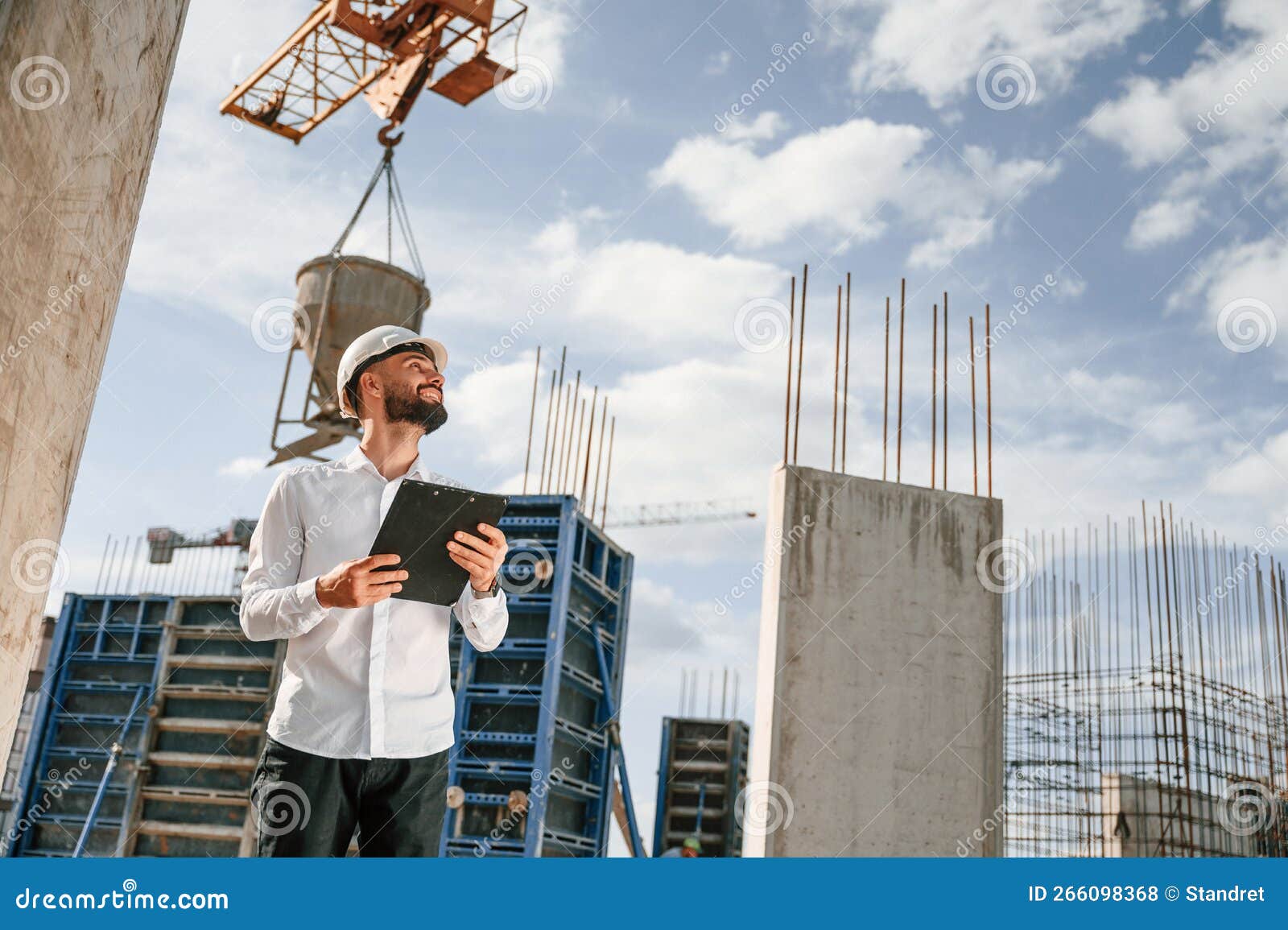 Engineer is Holding Notepad. Man in Uniform is Working on the ...