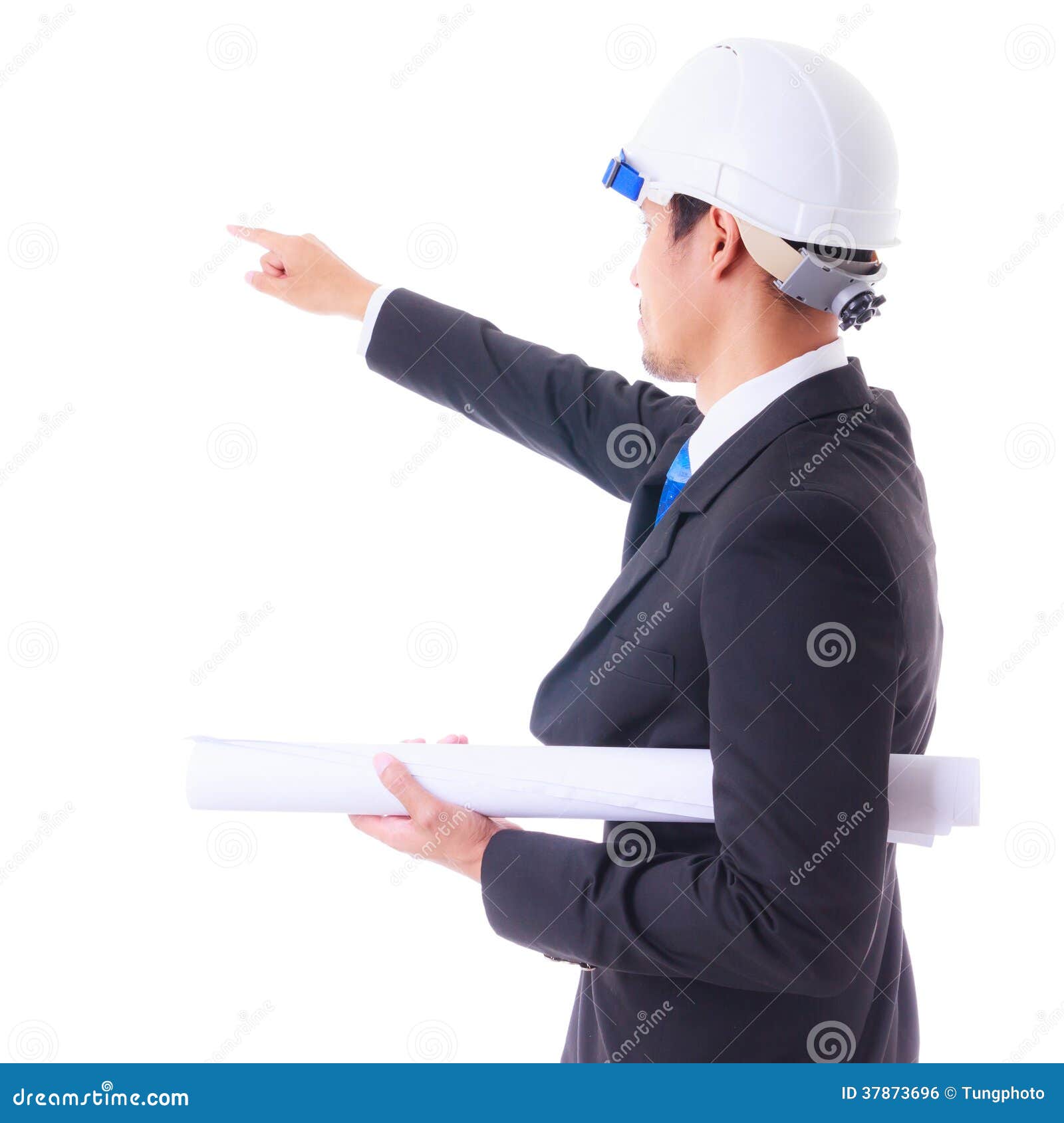 Engineer Holding Plan and Pointing To Construction Site Stock Photo ...