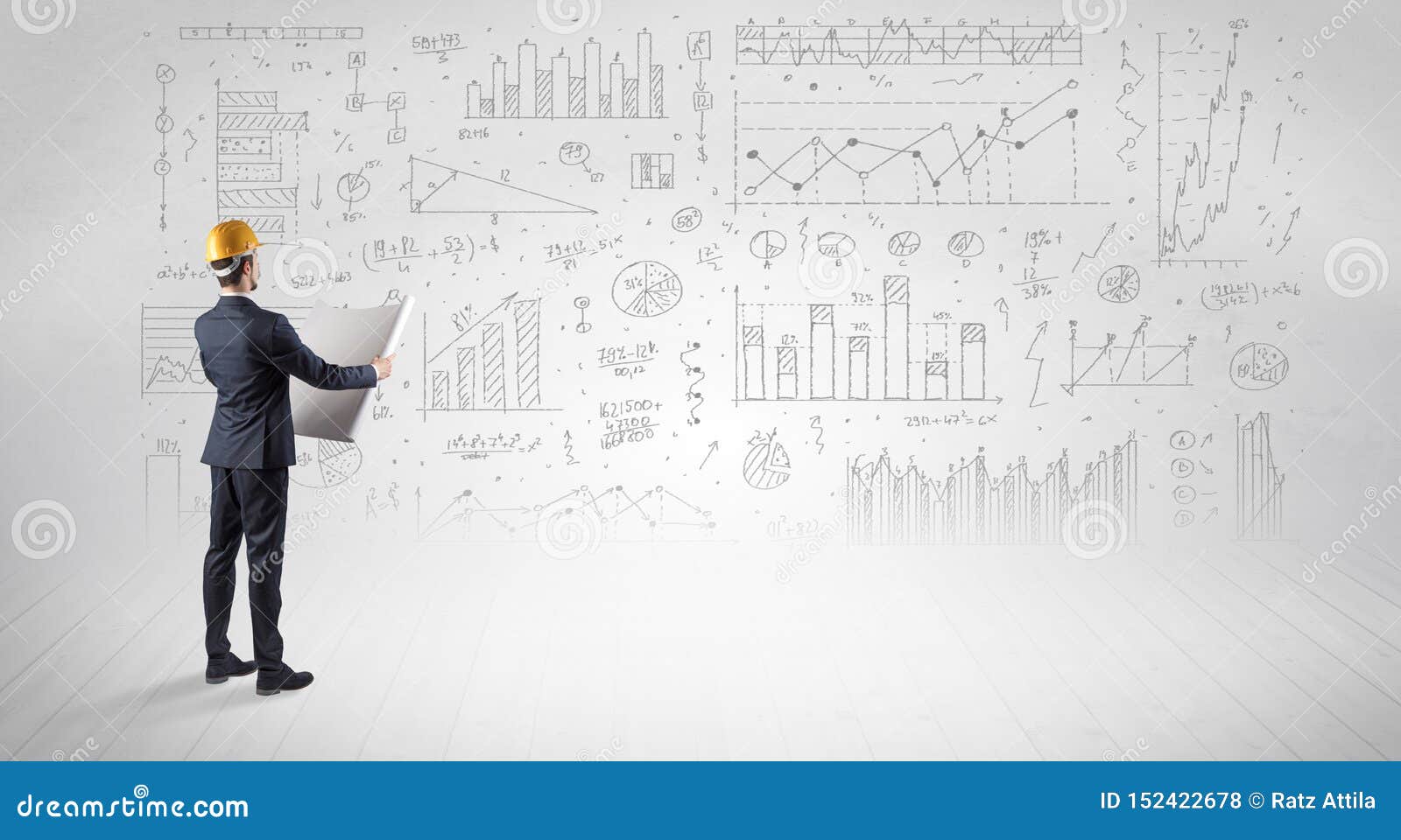 Engineer Holding a Plan and Standing with Graphs, Charts and Reports on ...