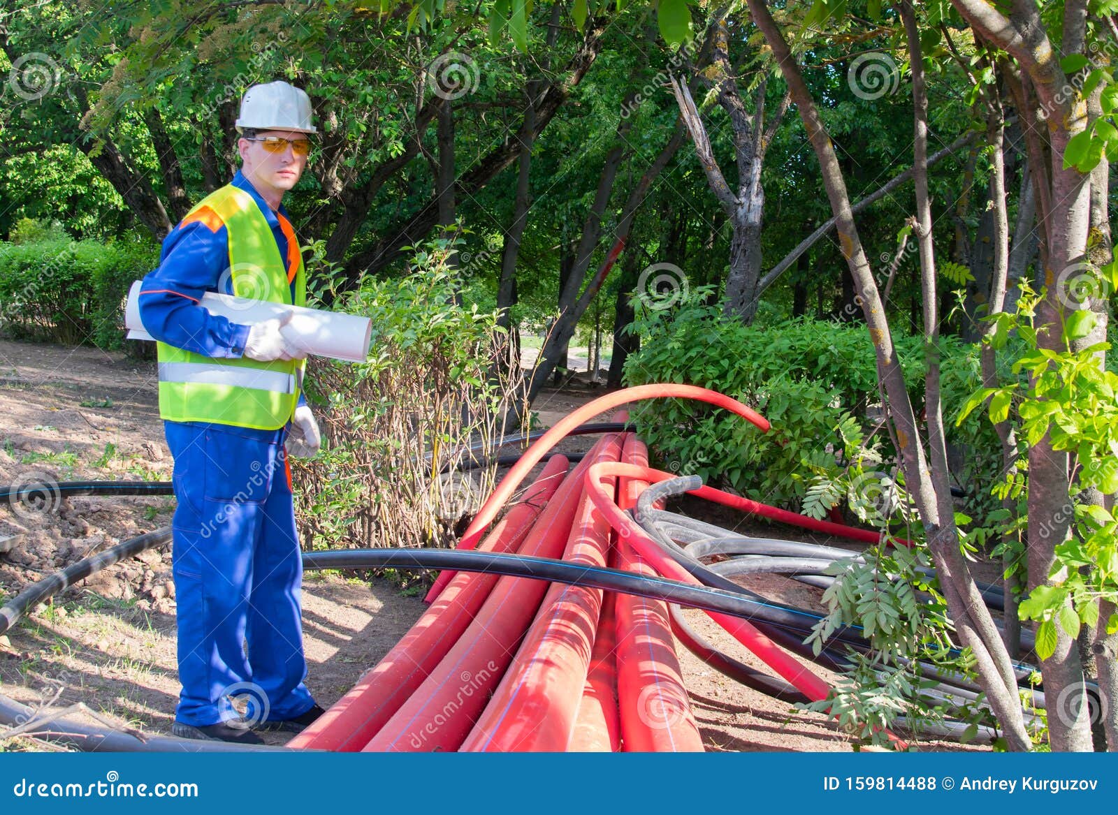 The Engineer Holds a Bundle of Paper in His Hands, Communication ...