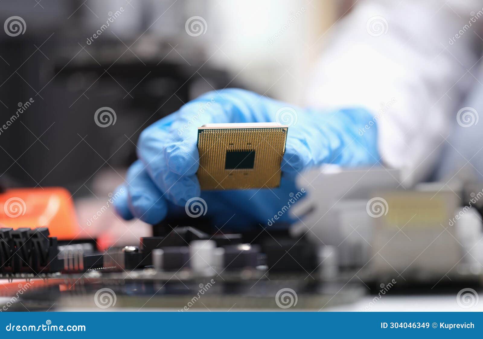 Engineer Holds in Hands Powerful Processor or Board after Repair Stock ...