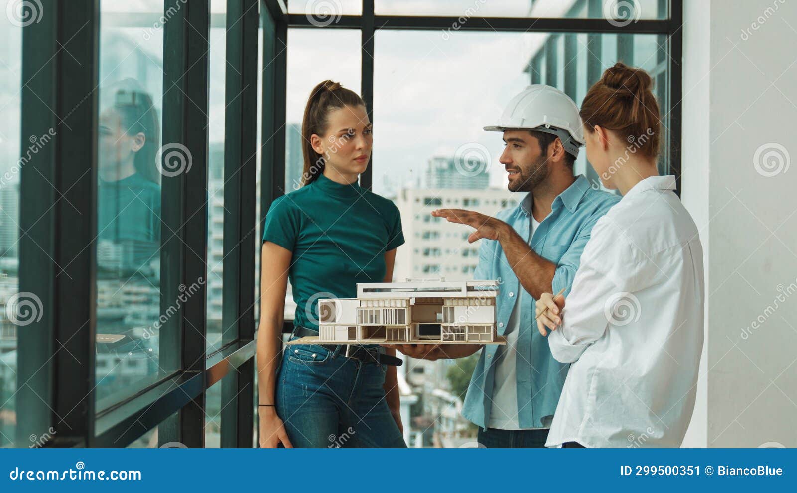 Engineer Holds House Model and Explain about House Construction ...