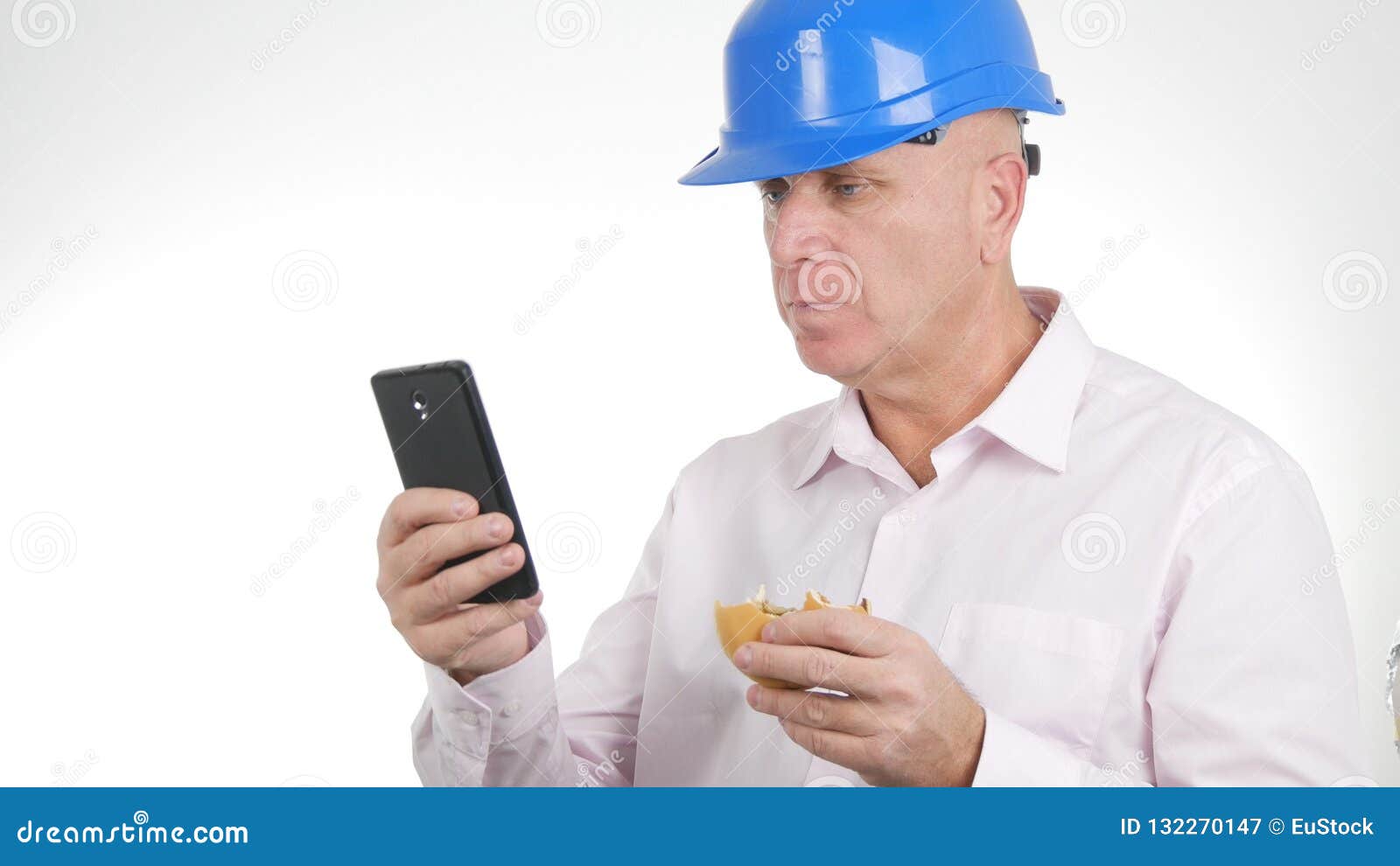 Engineer Image Eat a Sandwich and Text Using Cellphone Stock Image ...