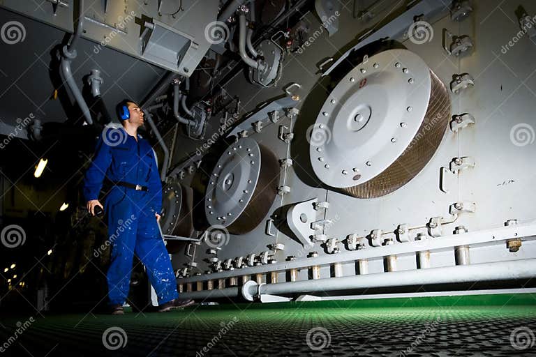 Engineer Inspecting Engine Interior in Offshore Installation Stock ...