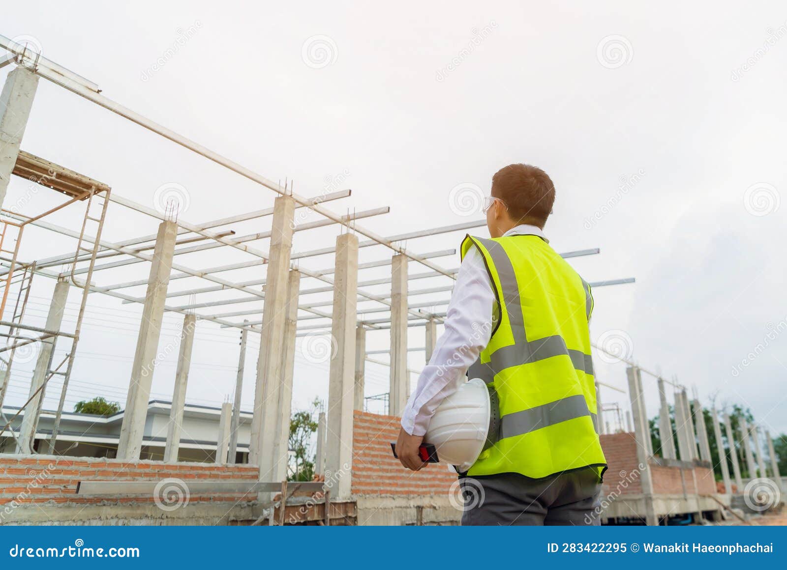 Engineer Inspecting the House Structure Stand with Your Back on Your ...