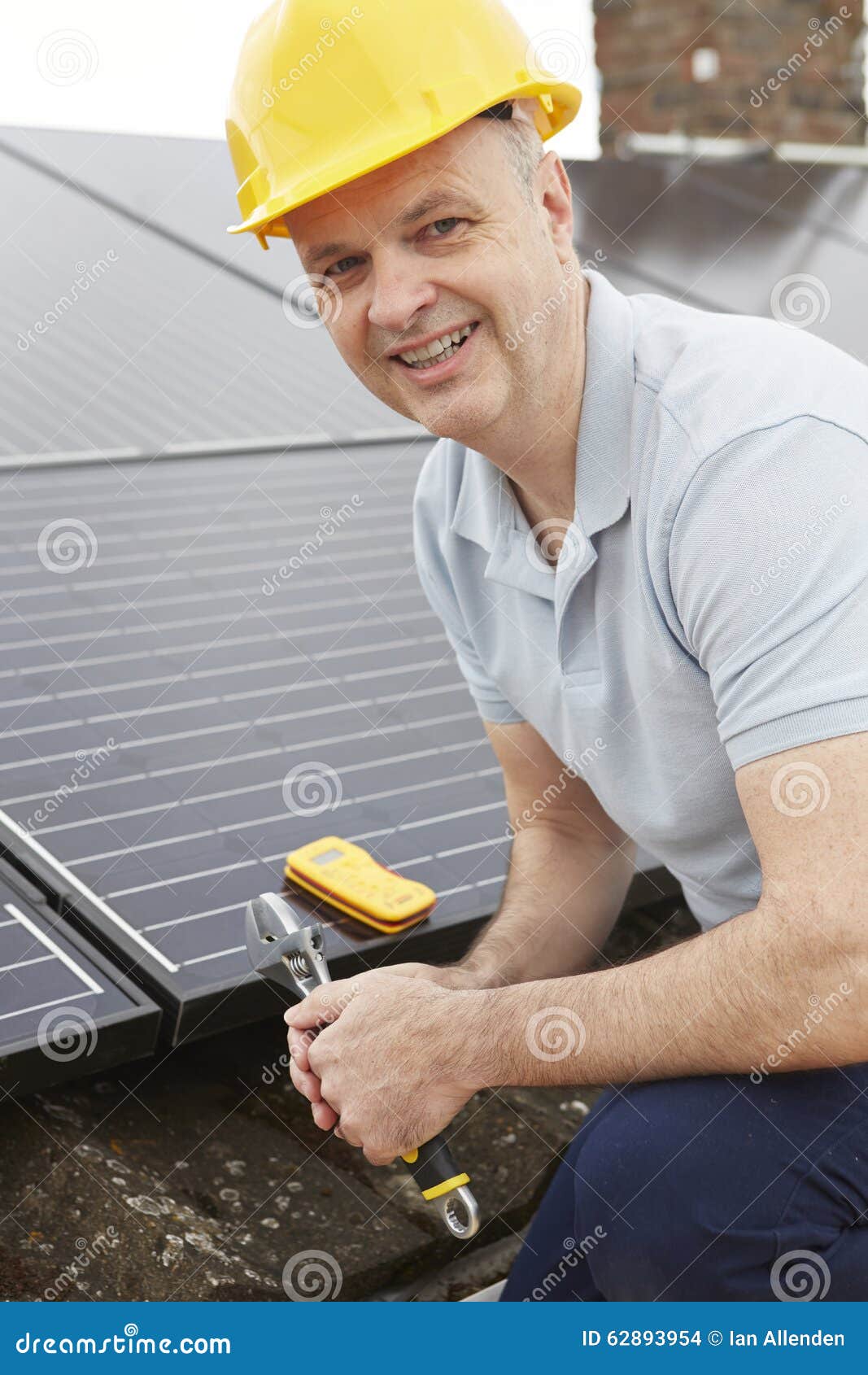 Engineer Installing Solar Panels on Roof of House Stock Photo - Image ...