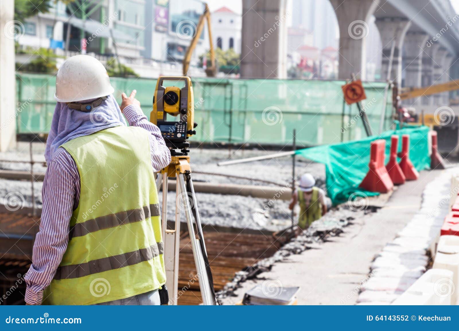 Engineer Instructing while Operating Dumpy Automatic Level Instr ...