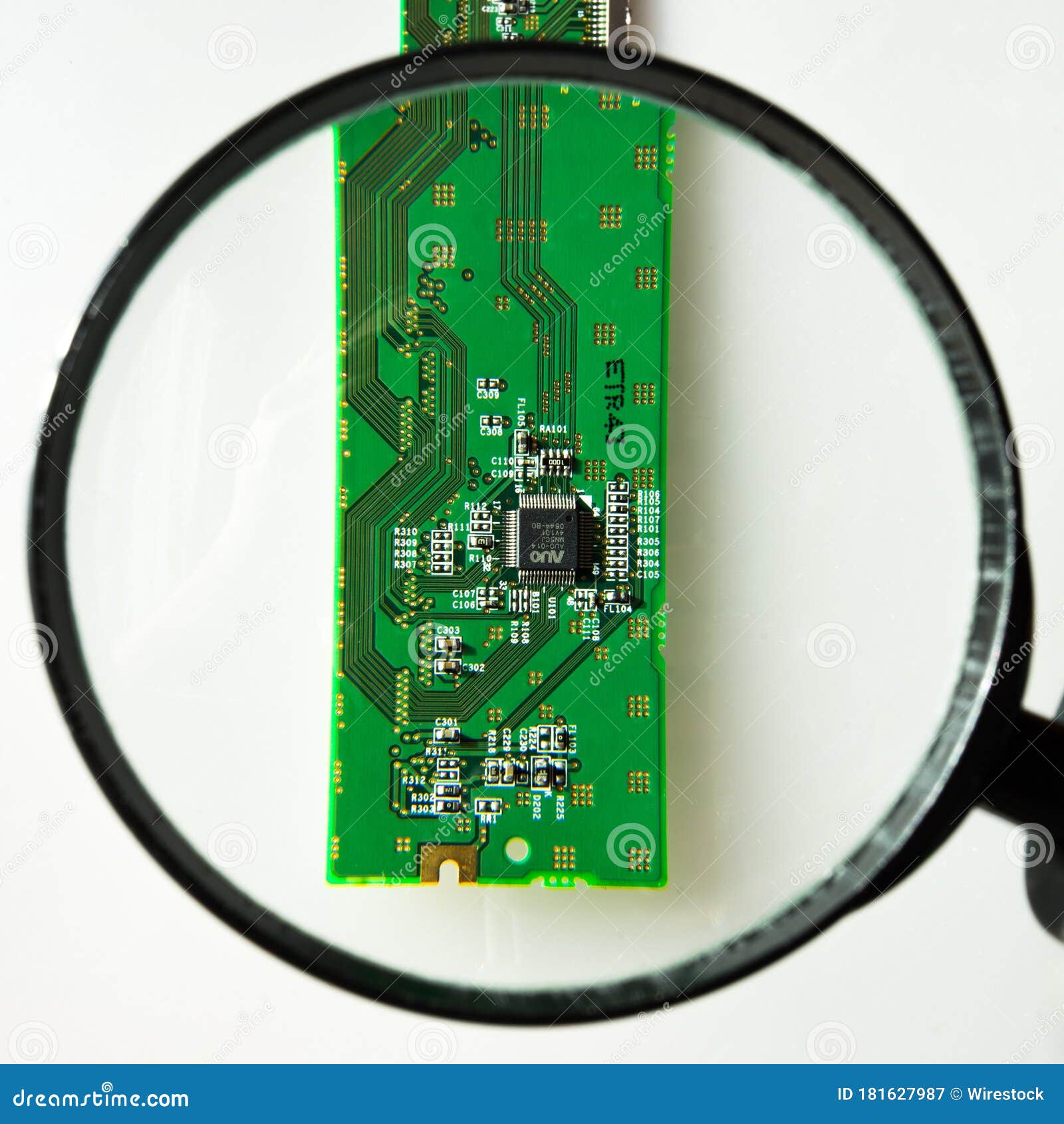 Engineer Looking at a Circuit Board through a Magnifying Glass ...