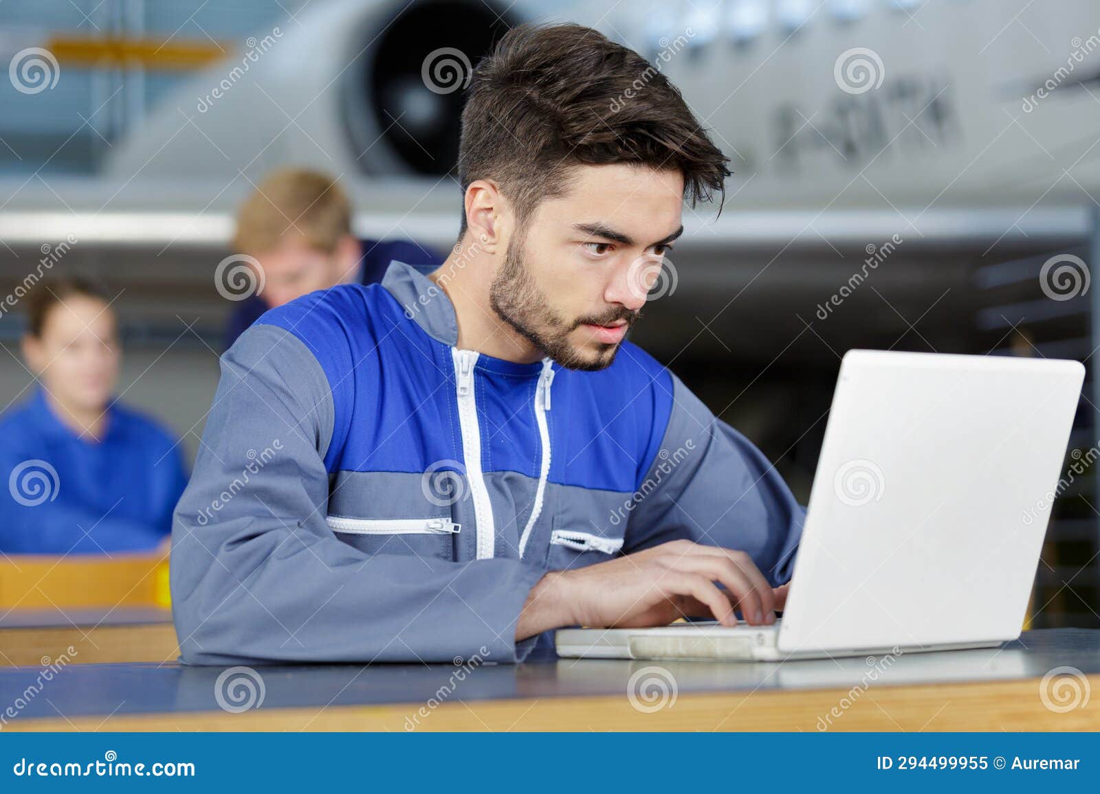 Engineer Looking at Laptop for Airplane Maintenance Stock Image - Image ...