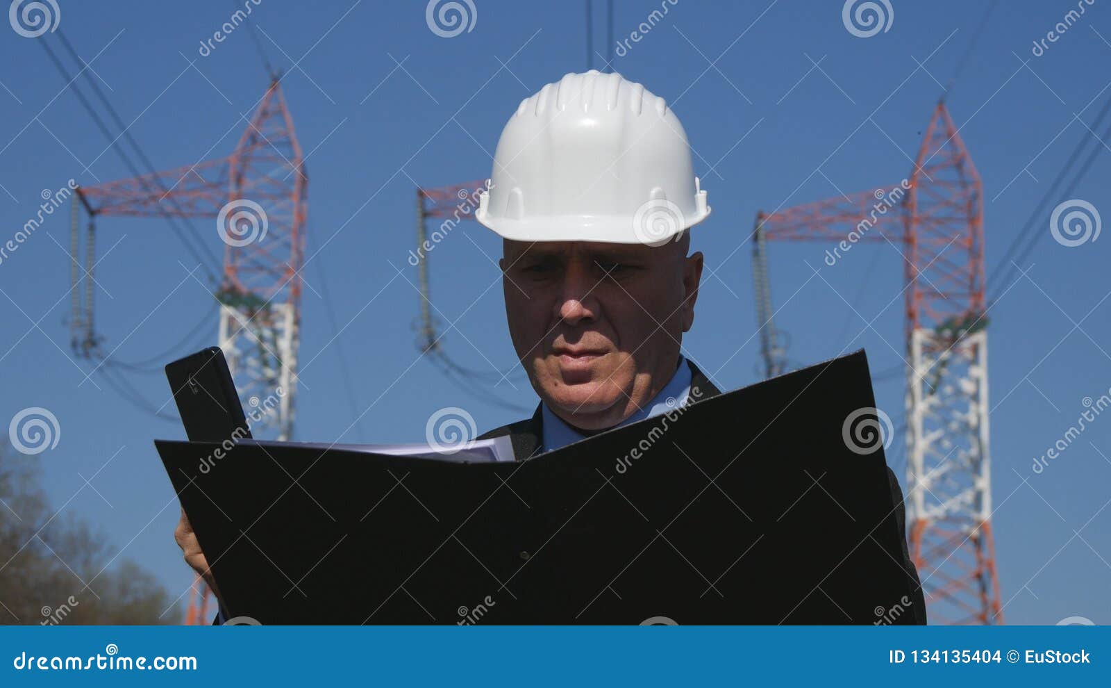 Engineer Looking in Technical File for Maintenance Activity Stock Photo ...