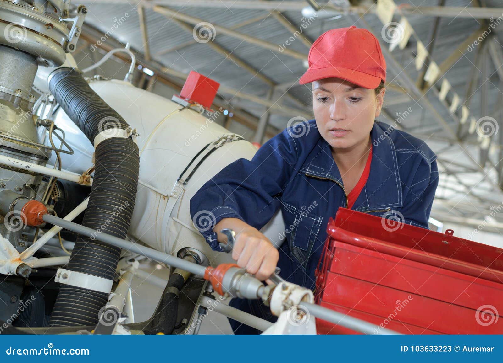 Engineer Maintaining Helicopter Engine Stock Image - Image of woman ...