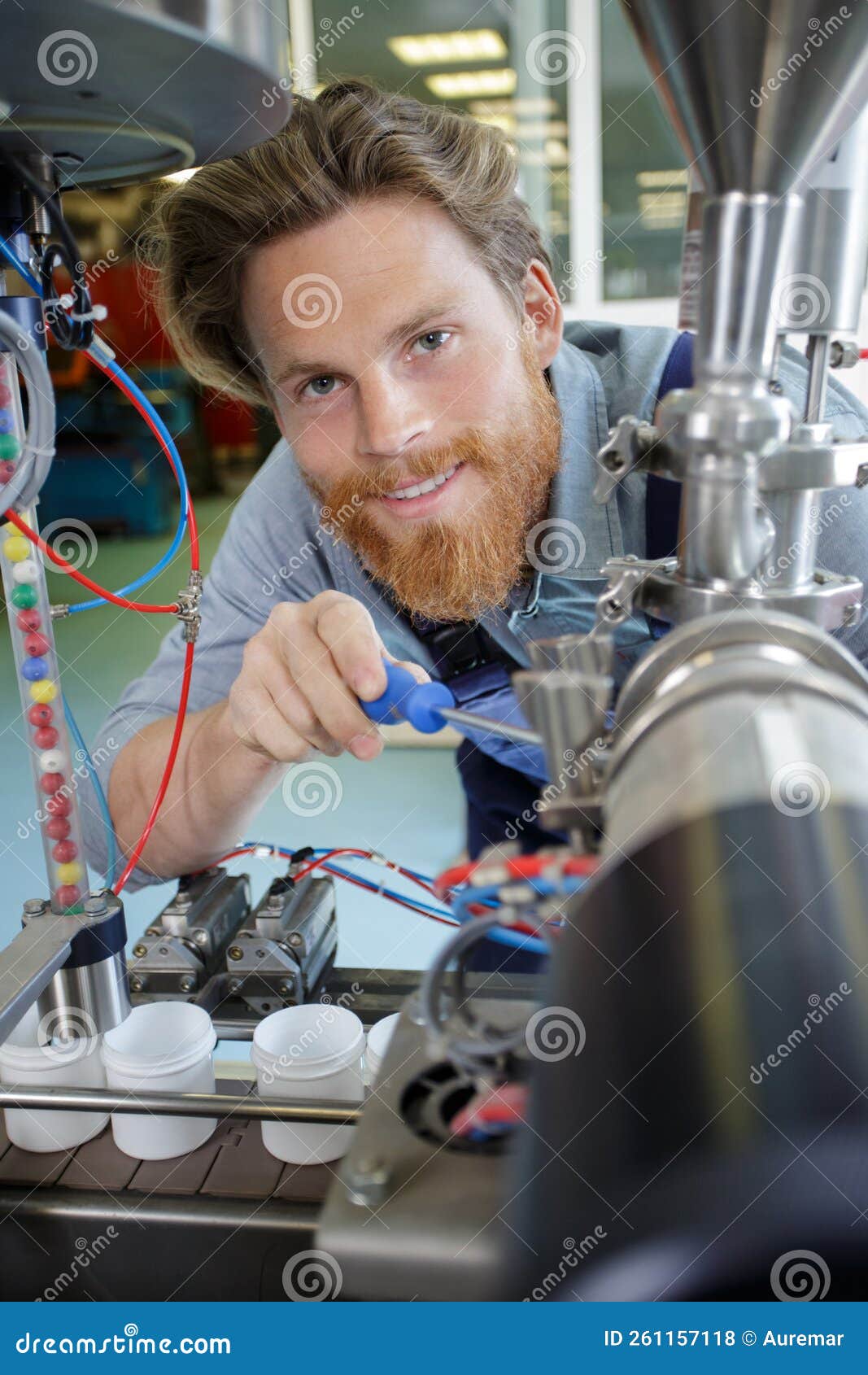 Engineer Maintaining Machinery in Factory Stock Photo - Image of ...