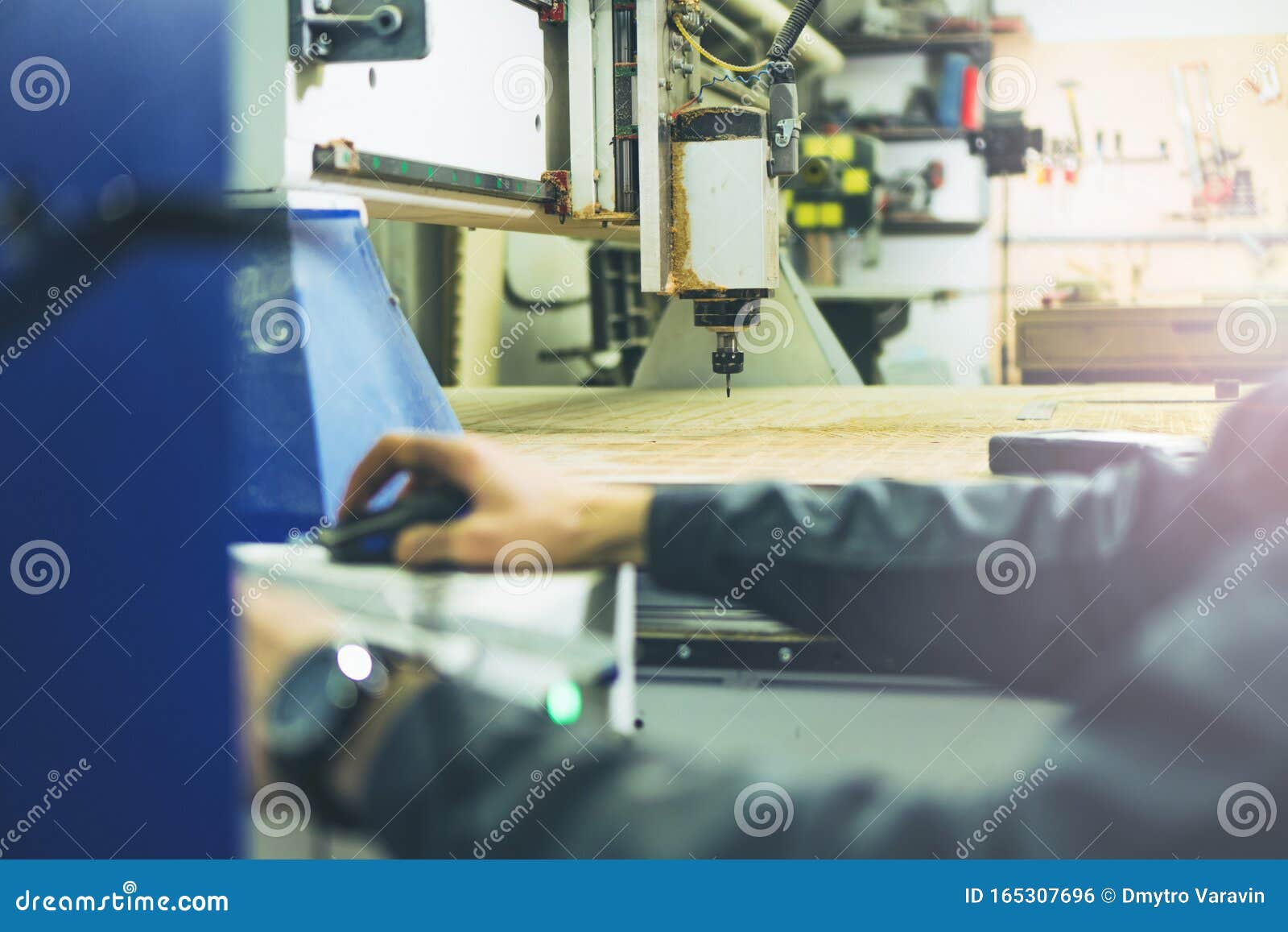 Engineer Making Settings on Remote Control of CNC Wood Milling Machine ...