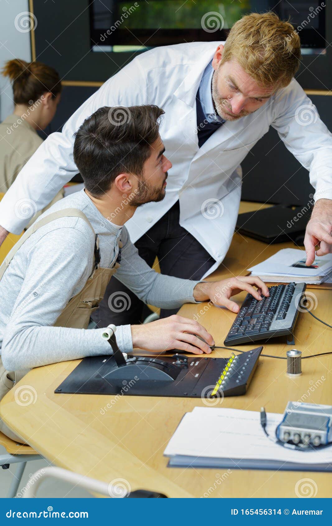 Engineer Male Apprentice Talking To Mentor in Office Stock Photo ...