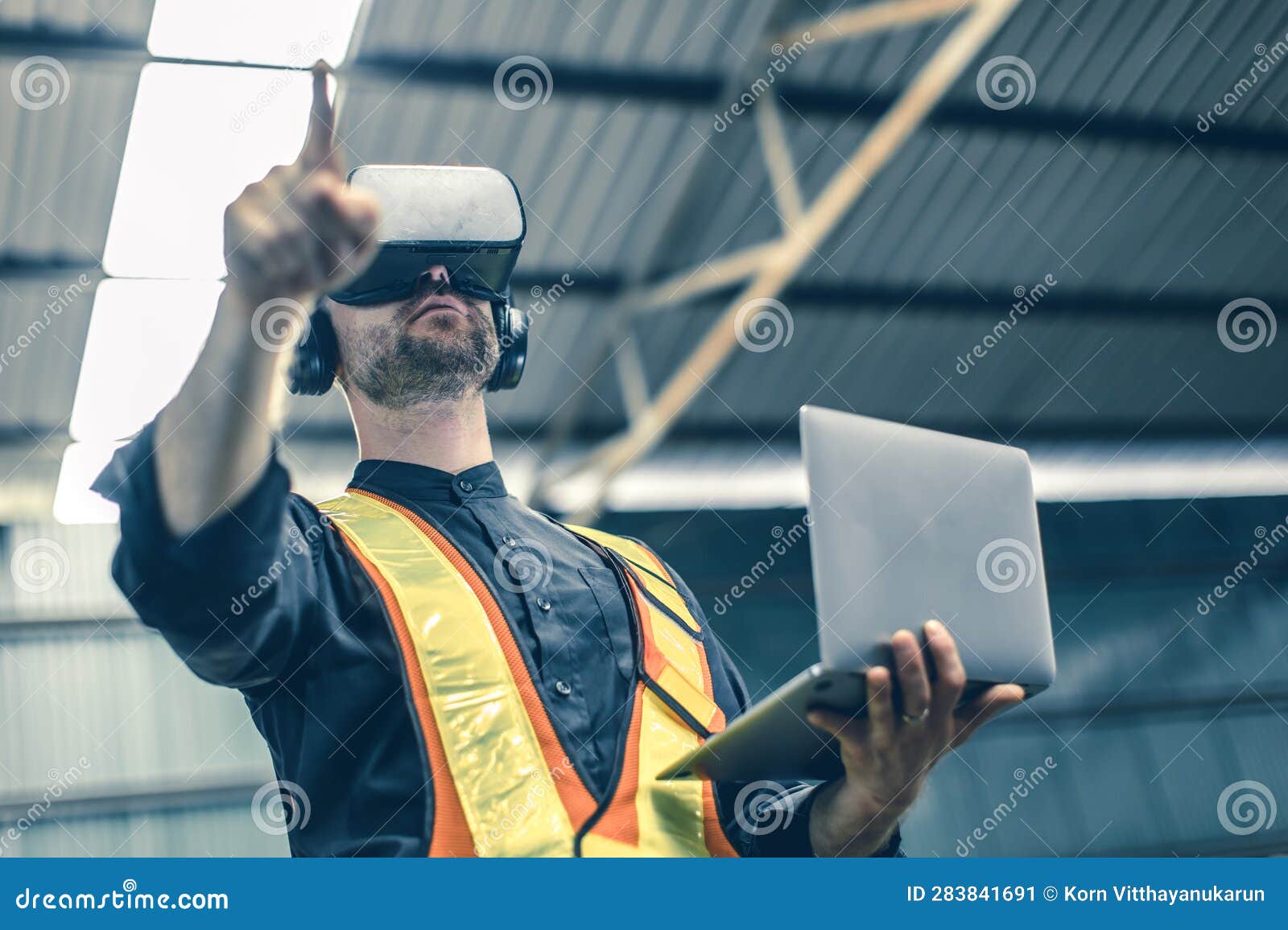 Engineer Male Using VR Virtual Reality Technology in Modern Warehouse ...
